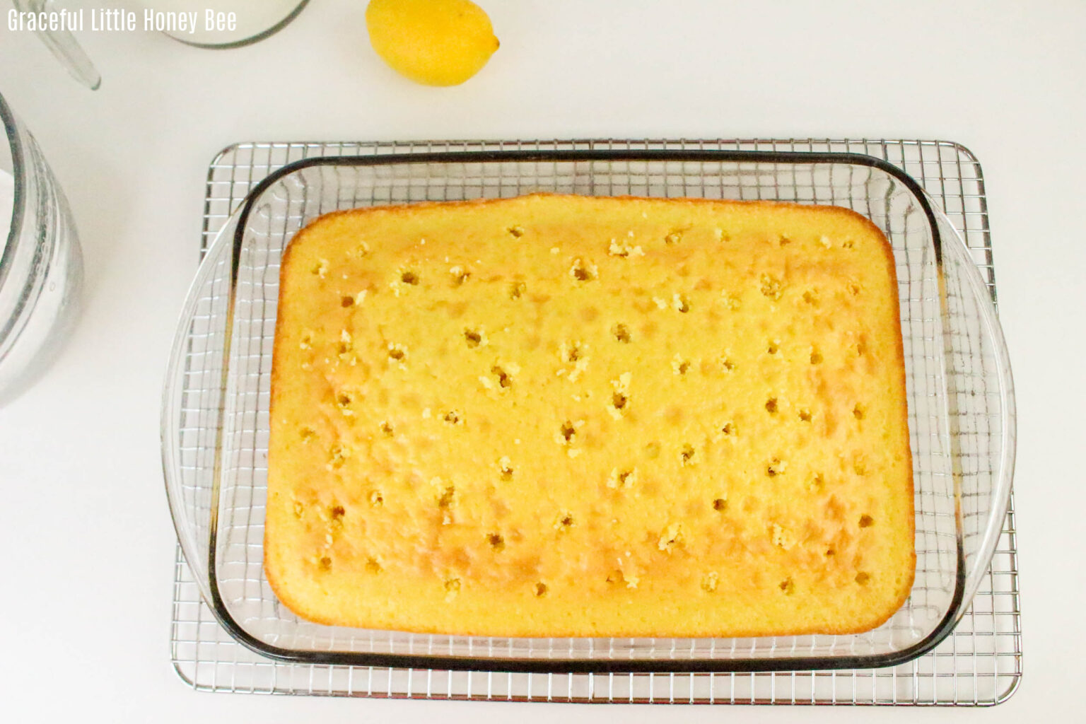 Lemon Pudding Poke Cake - Graceful Little Honey Bee
